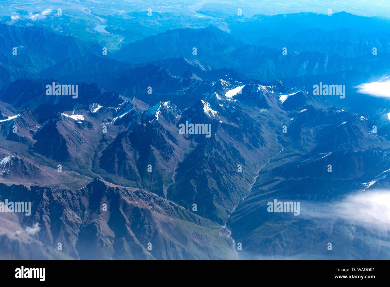 Aerial views of snow mountains in Xinjiang, the largest province in ...
