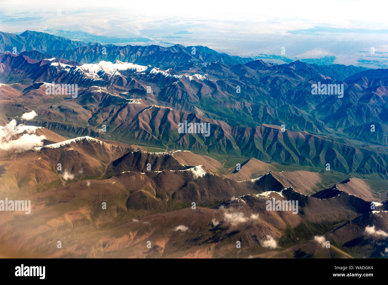 Aerial views of snow mountains in Xinjiang, the largest province in ...