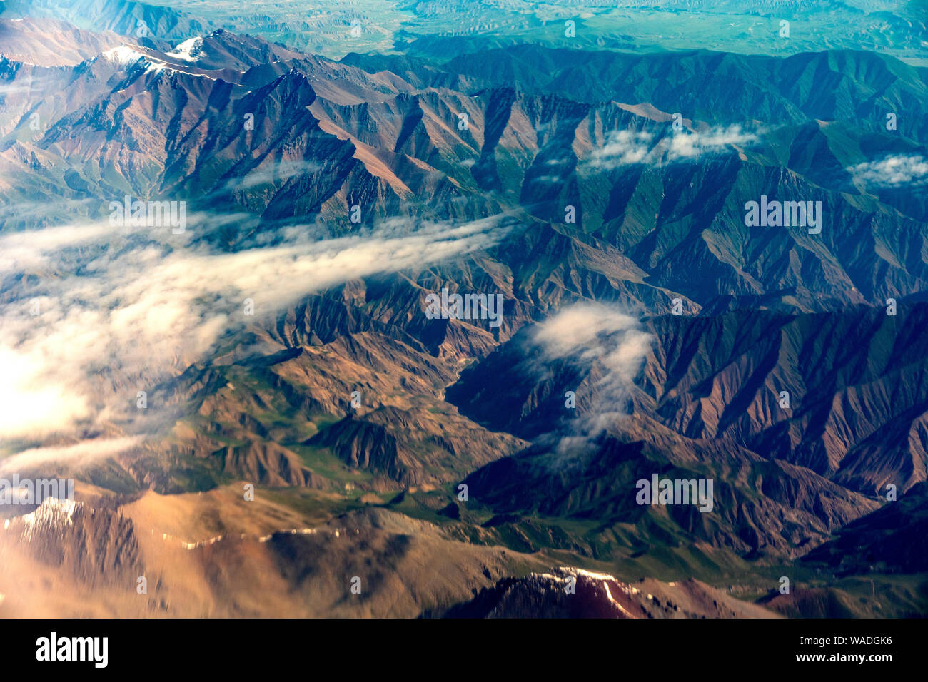 Aerial views of snow mountains in Xinjiang, the largest province in ...