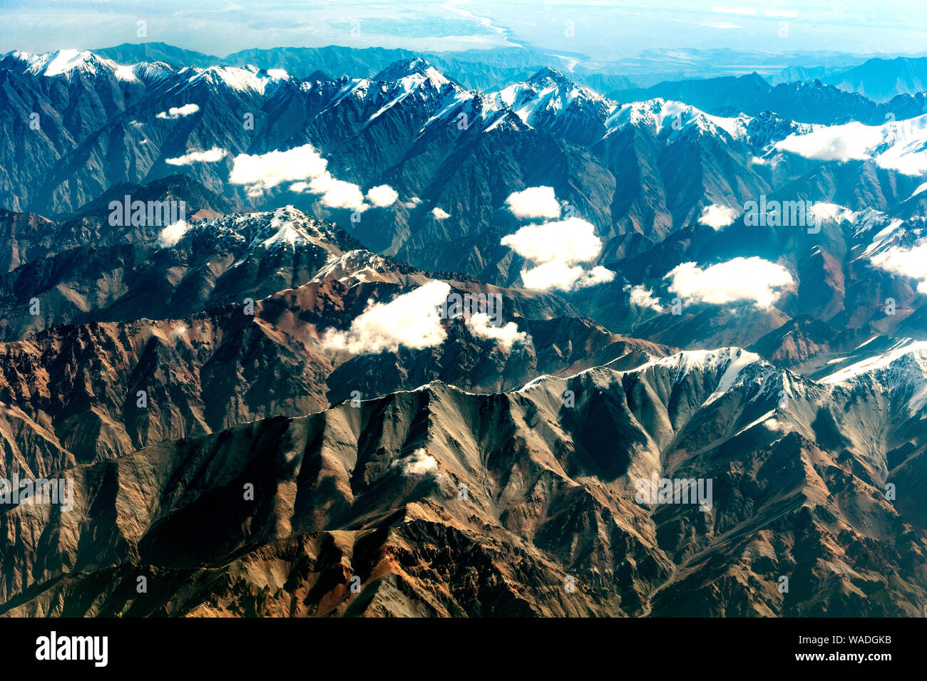 Aerial views of snow mountains in Xinjiang, the largest province in ...