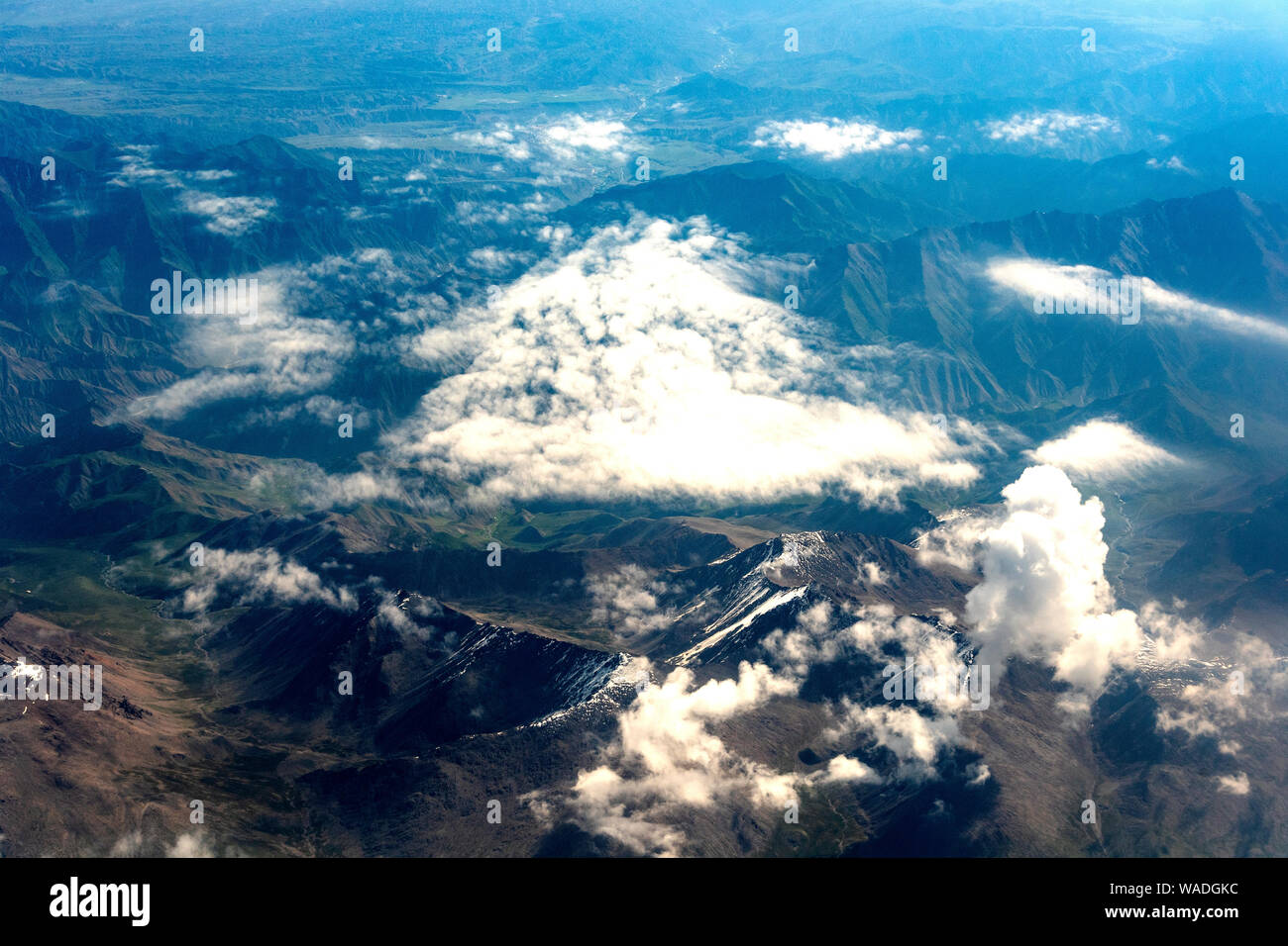 Aerial views of snow mountains in Xinjiang, the largest province in ...