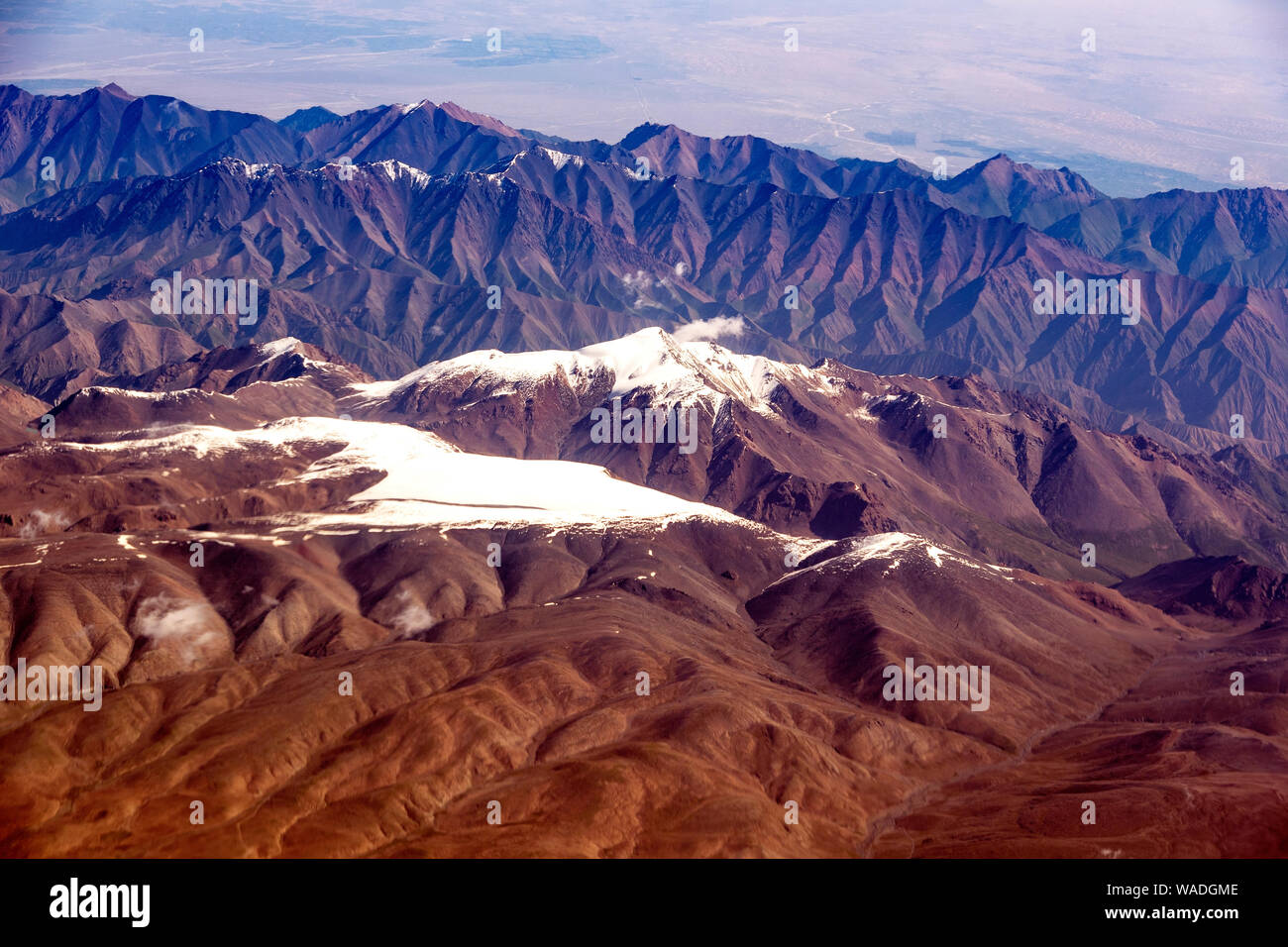 Aerial views of snow mountains in Xinjiang, the largest province in ...