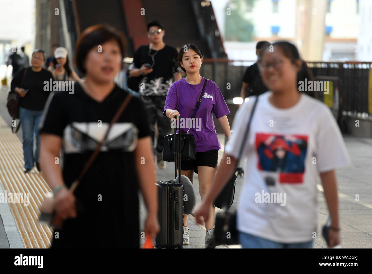 Chinese parents and their kids board their train to go back home during ...