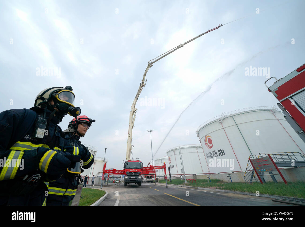 Chinese firefighters take part in the first fire drill at the Beijing ...
