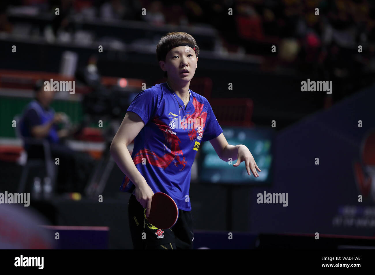 Wang Manyu of China reacts as she competes against Miyu Nagasaki of ...
