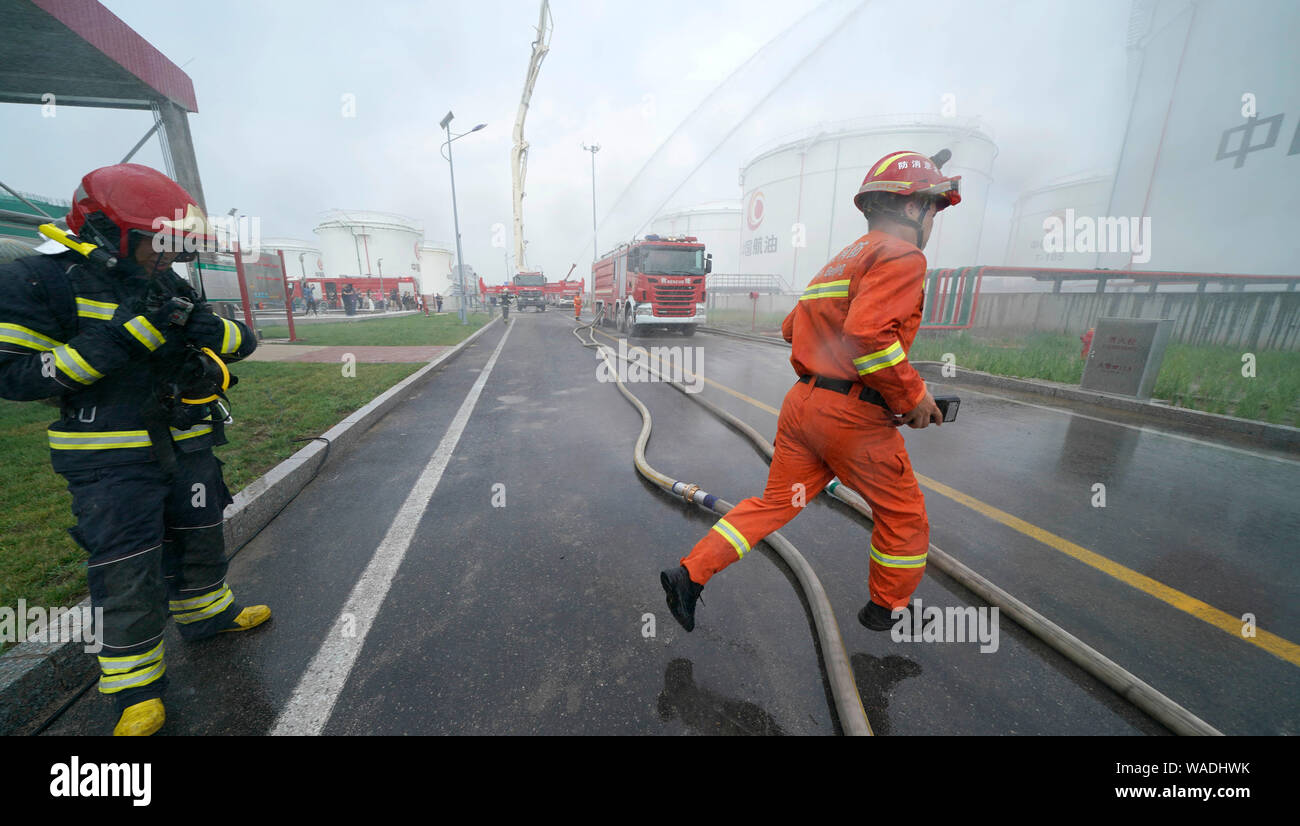 Chinese firefighters take part in the first fire drill at the Beijing ...