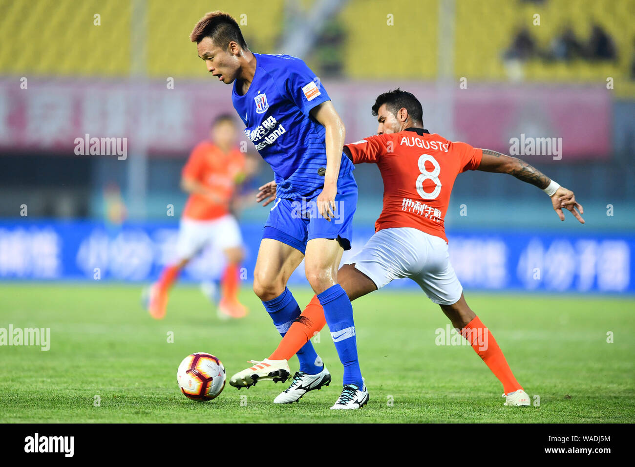 Argentine football player Augusto Fernandez, right, of Beijing Renhe ...