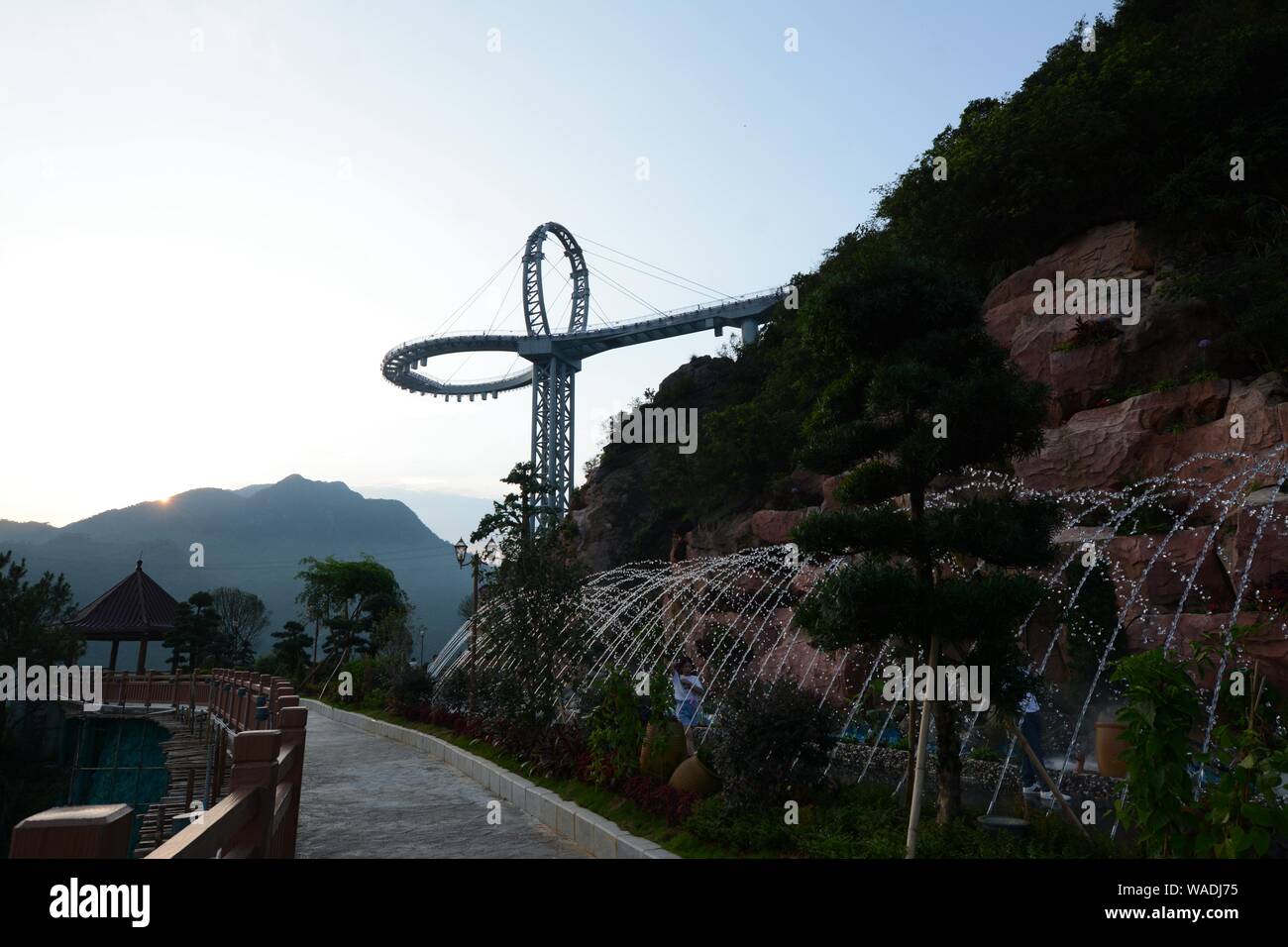 Aerial view of Guangdong's highest circular glass bridge crossing on ...