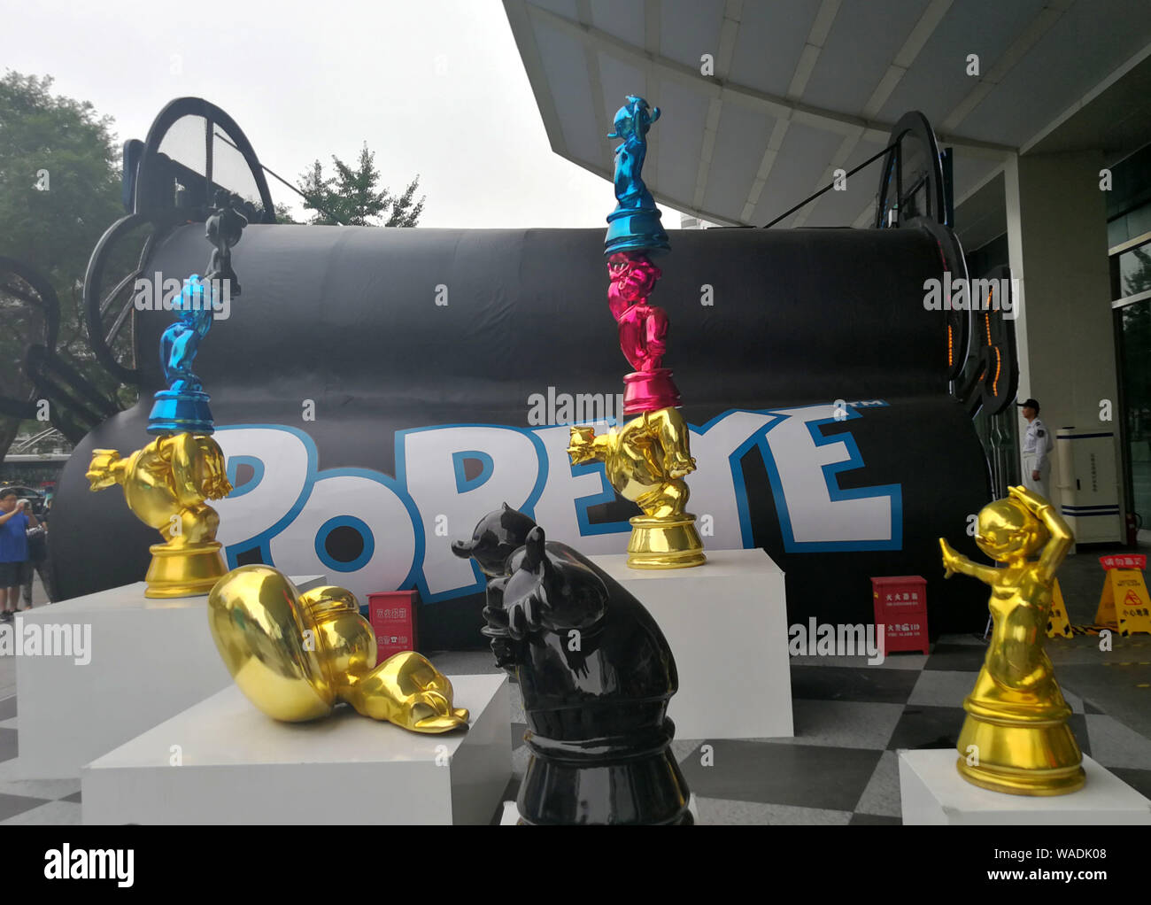 Customers view sculptures featuring cartoon character "Popeye the ...
