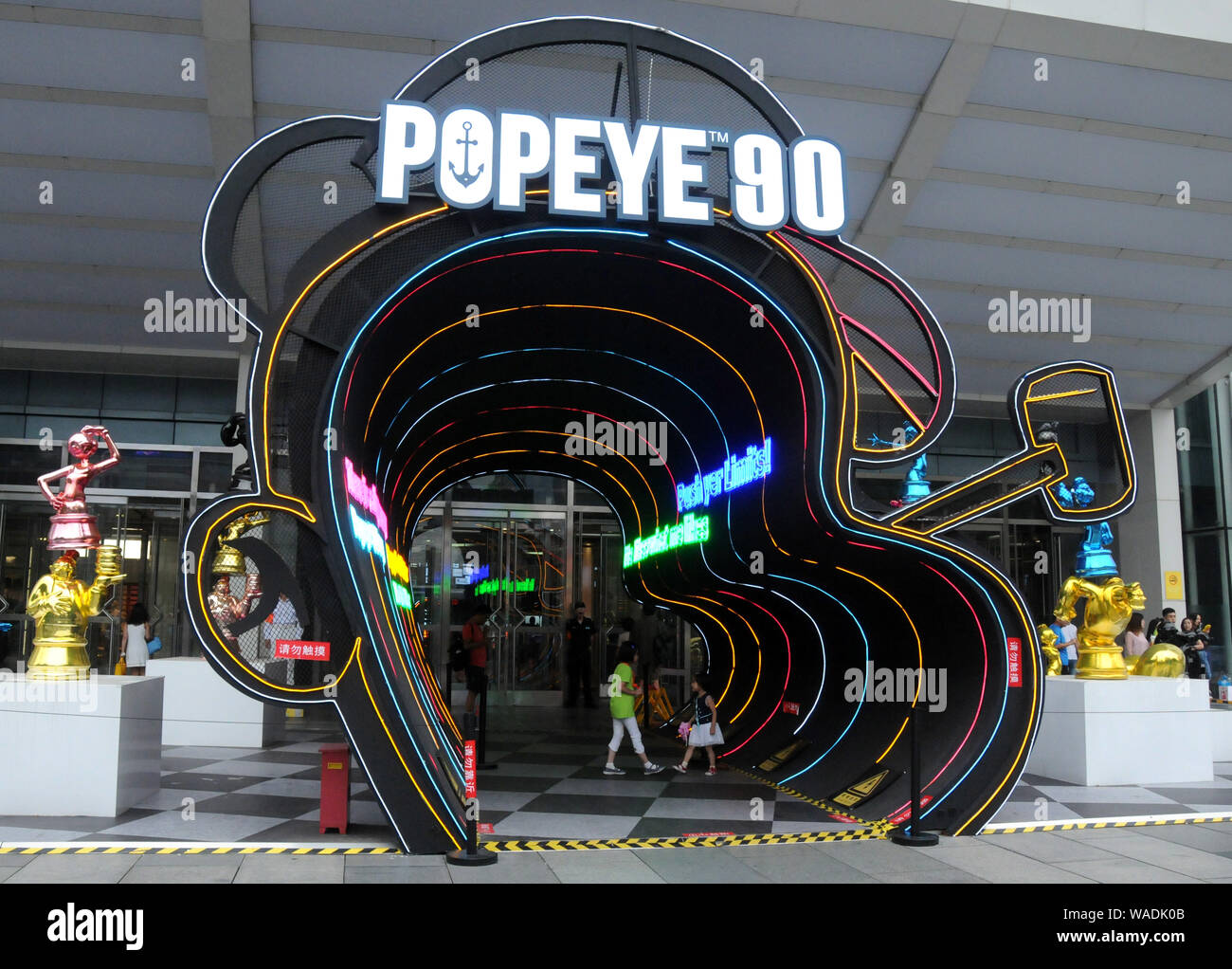 Customers view sculptures featuring cartoon character "Popeye the ...