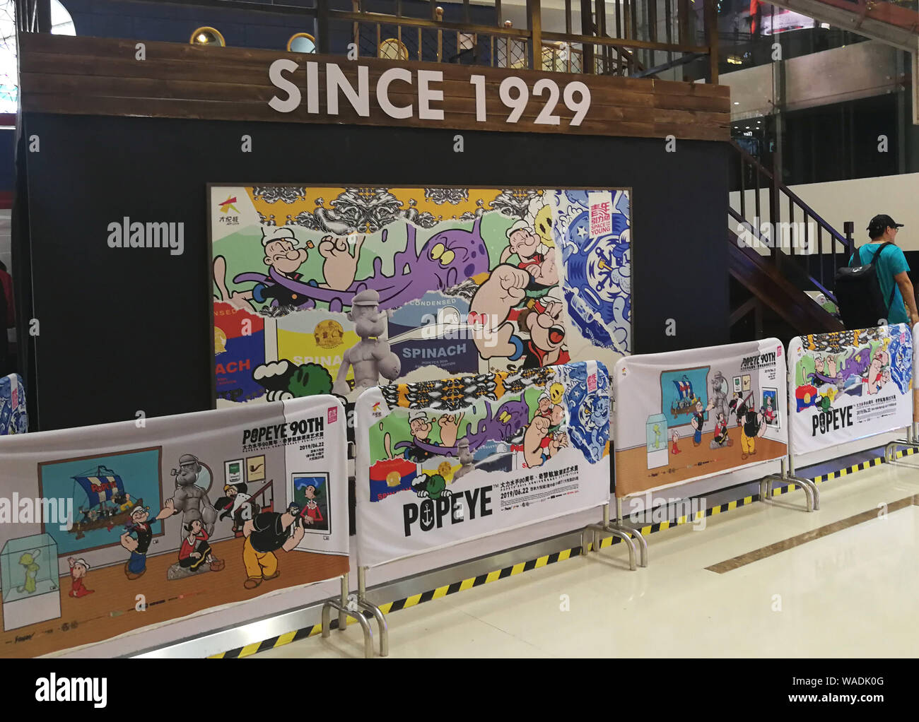 Customers view sculptures featuring cartoon character "Popeye the ...