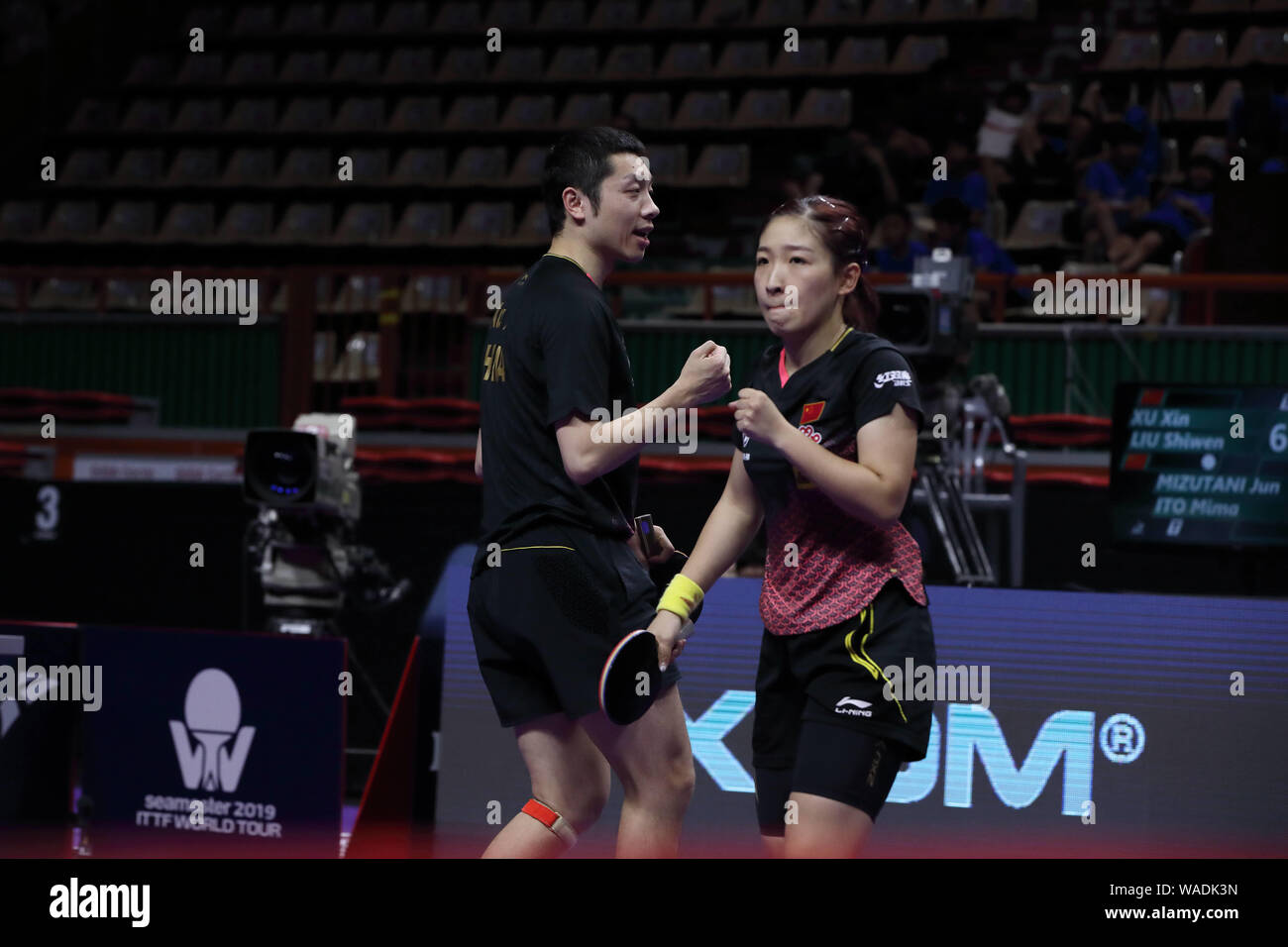 Xu Xin and Liu Shiwen of China celebrate after scoring against Jun ...