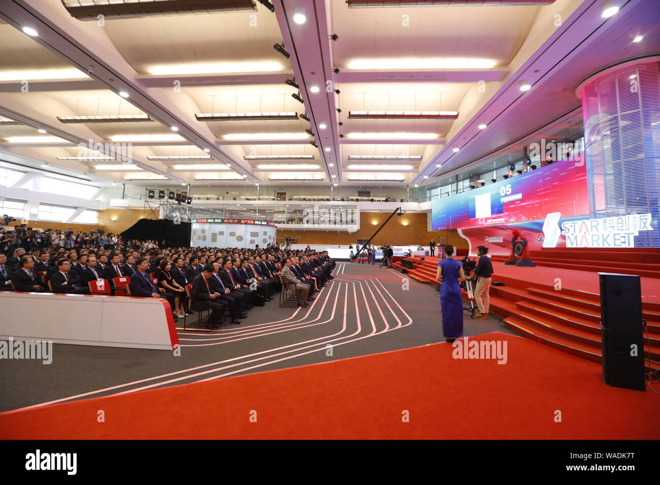 Representatives of 25 companies attend the listing ceremony of the ...