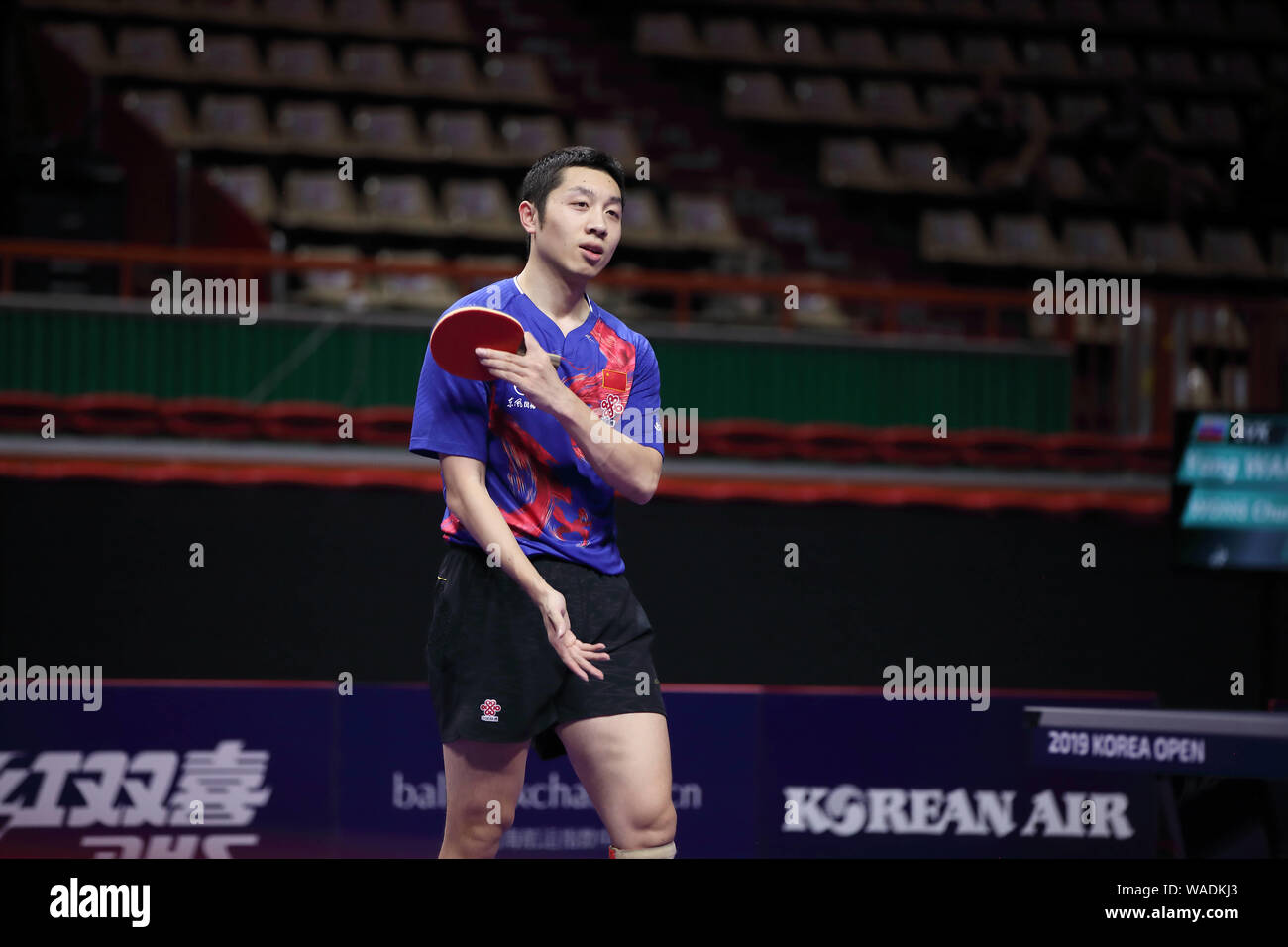 Xu Xin of China reacts as he competes against Yuki Hirano of Japan in ...