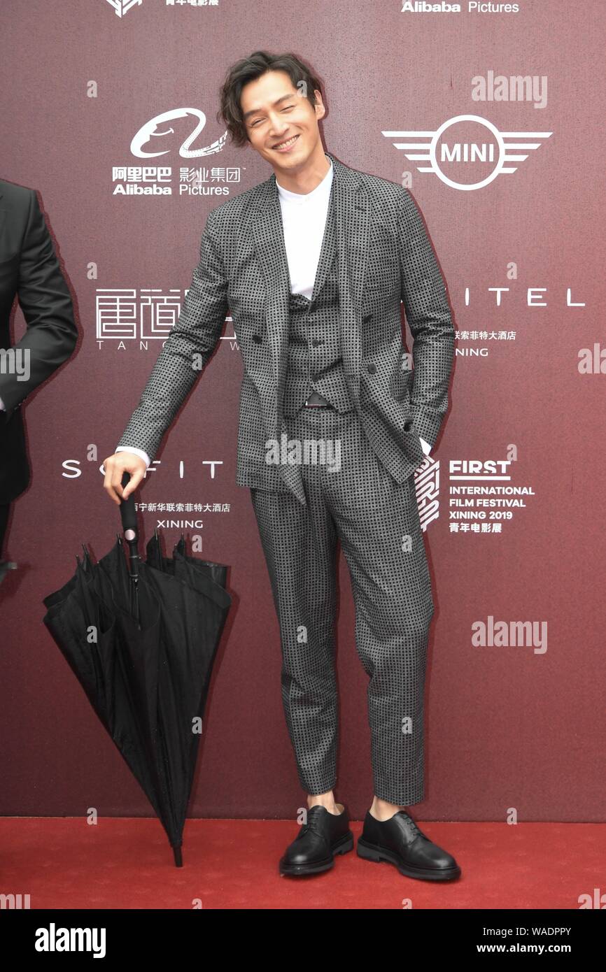 Chinese actor and singer Hu Ge poses as he arrives on the red carpet ...