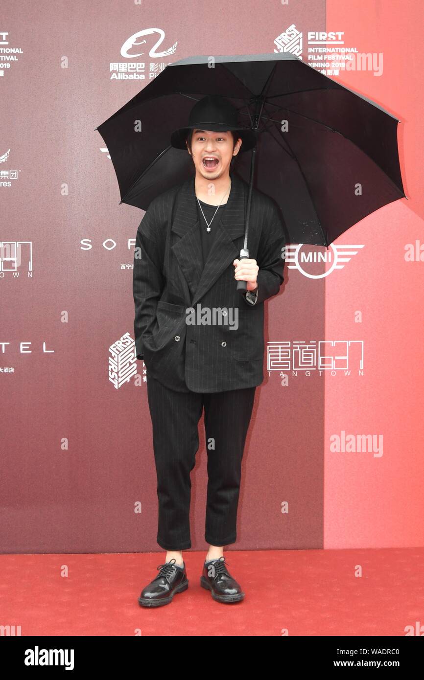 Taiwanese actor Chen Bolin poses as he arrives on the red carpet for ...