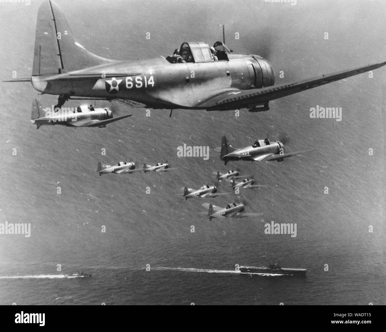 Douglas SBD-2 Dauntless of VS-6 in flight over USS Enterprise (CV-6) on ...