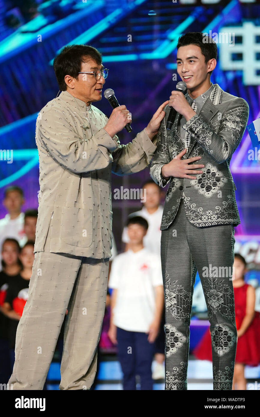 Hong Kong kungfu star Jackie Chan, left, and Chinese actor Leo Wu Lei attend the opening ...