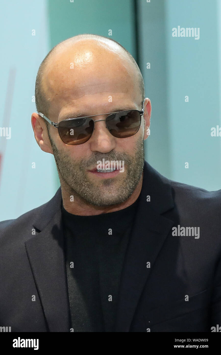 English actor Jason Statham arrives as he visits a dealership store of ...