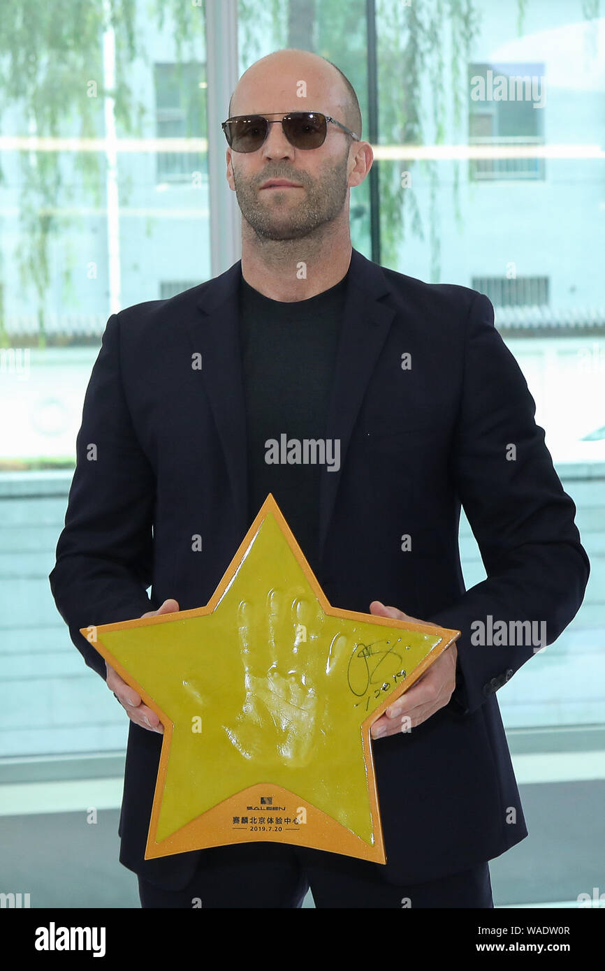 English actor Jason Statham arrives as he visits a dealership store of ...