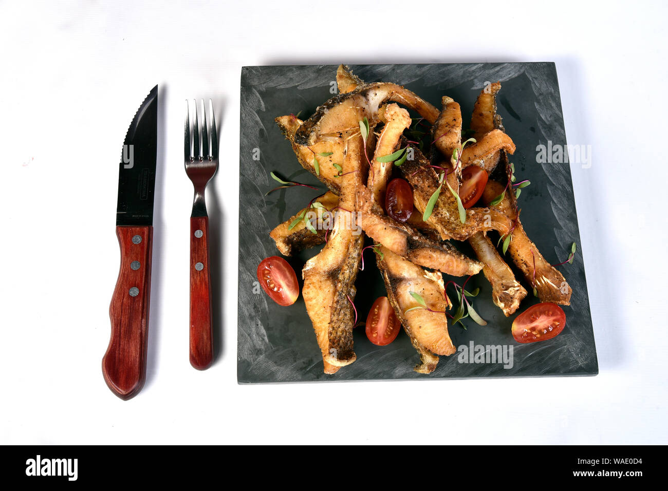 fried fish strips served on stone Stock Photo - Alamy
