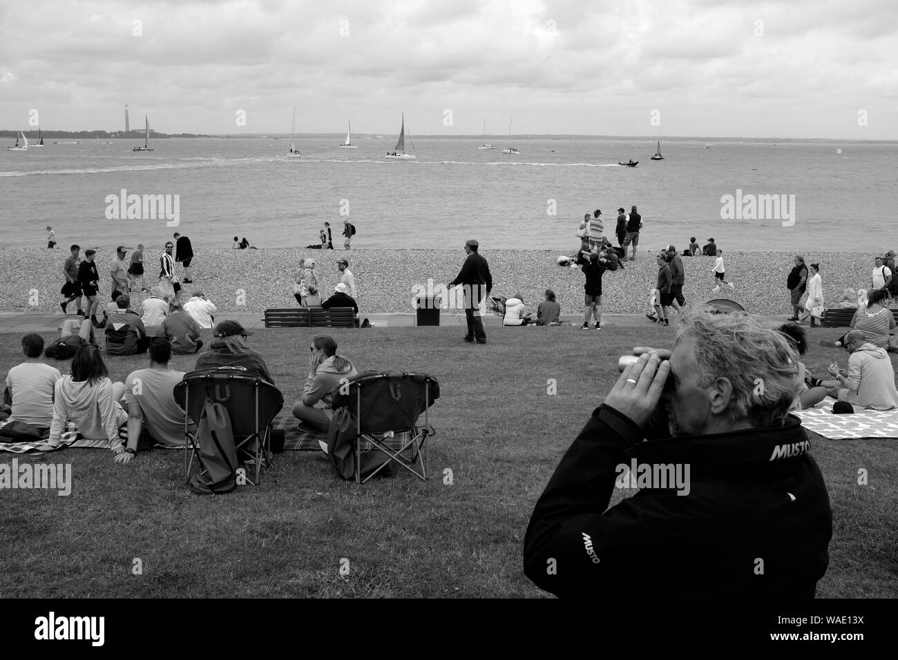 Spectators during Cowes Week on The Green at Cowes seafront Cowes Isle ...