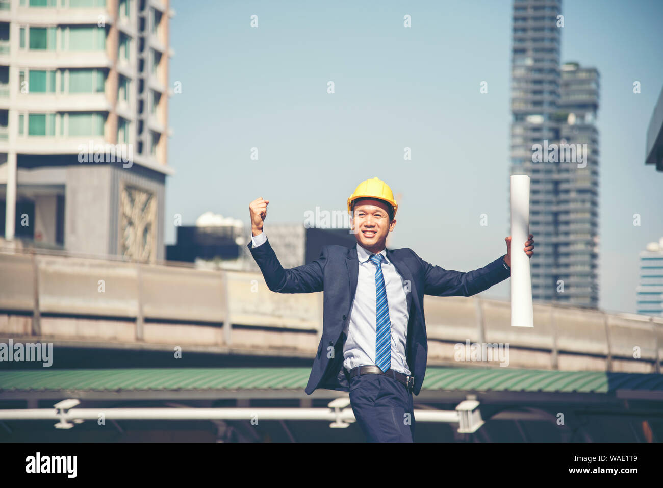 Success Engineer wear yellow helmet for safety hat building finish ...