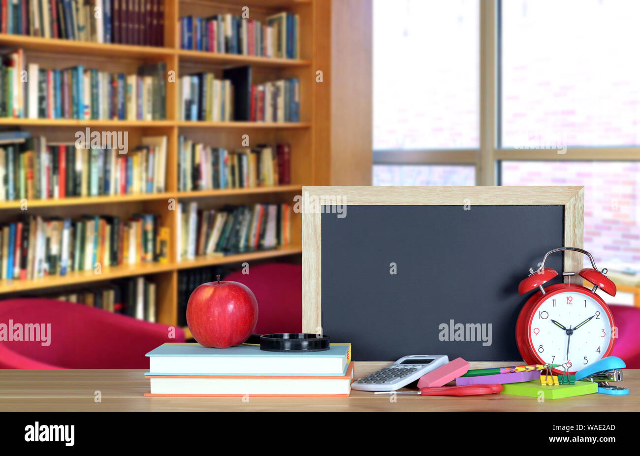 blurry background of a corner of library with book in the front for ...