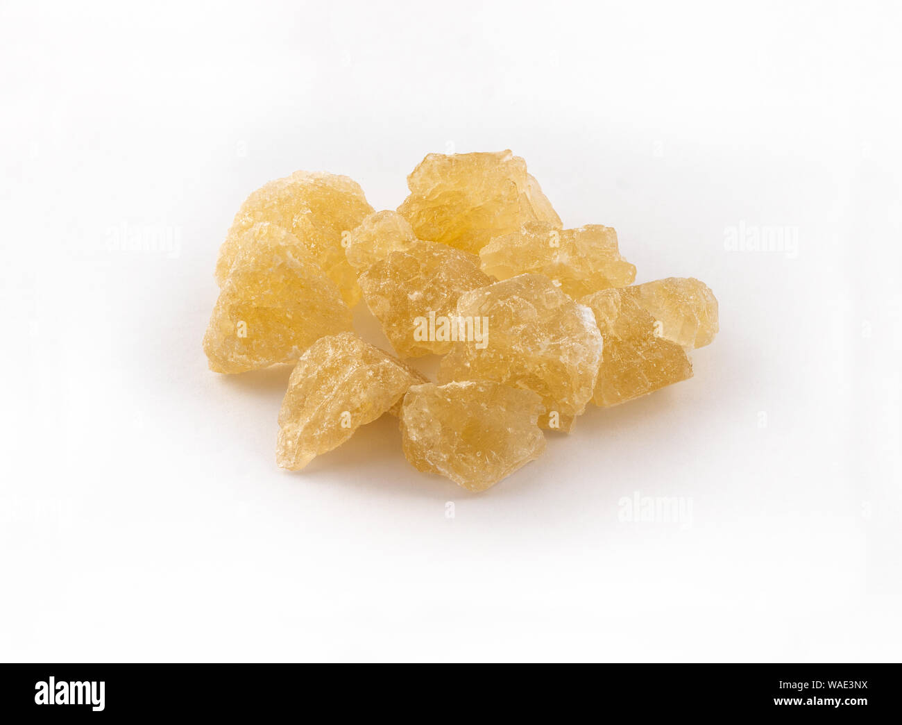 rock sugar crystals group on white background Stock Photo - Alamy