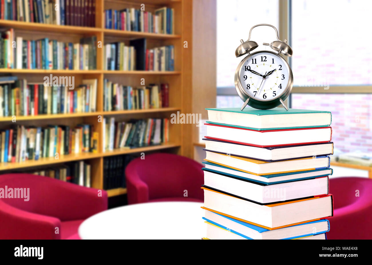 blurry background of a corner of library with book in the front for ...