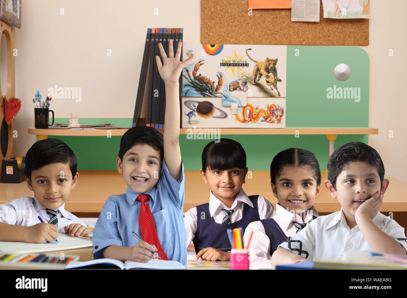School children studying in a classroom Stock Photo - Alamy