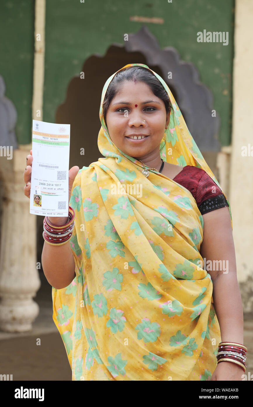 Rural woman showing an Aadhar card Stock Photo - Alamy