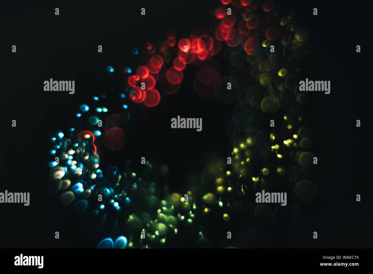 Beautiful multi colored bokeh background on a dark Stock Photo - Alamy
