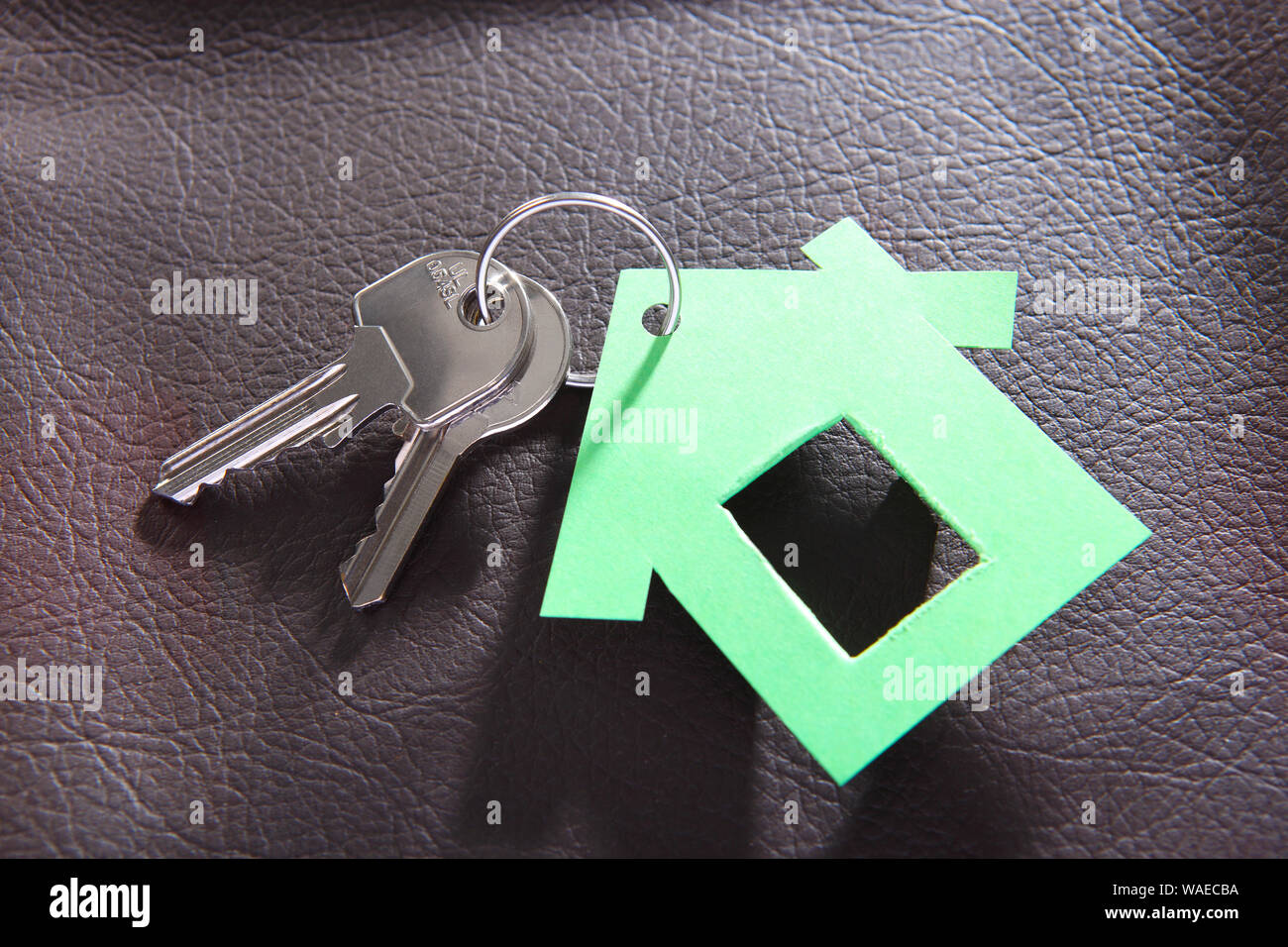 key with key ring shape of house Stock Photo - Alamy
