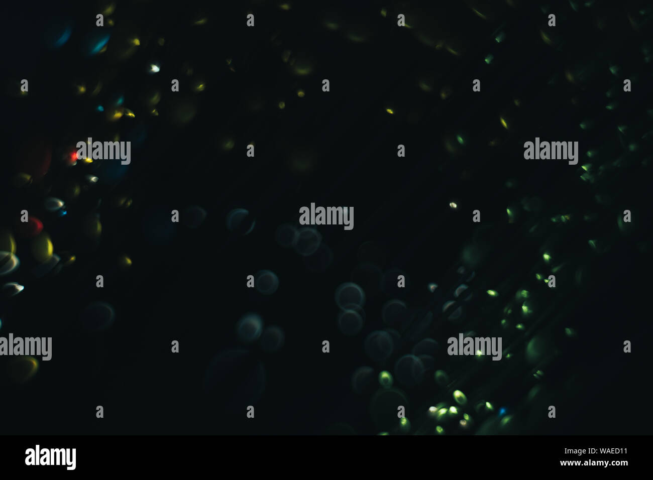 Beautiful multi colored bokeh background on a dark Stock Photo - Alamy