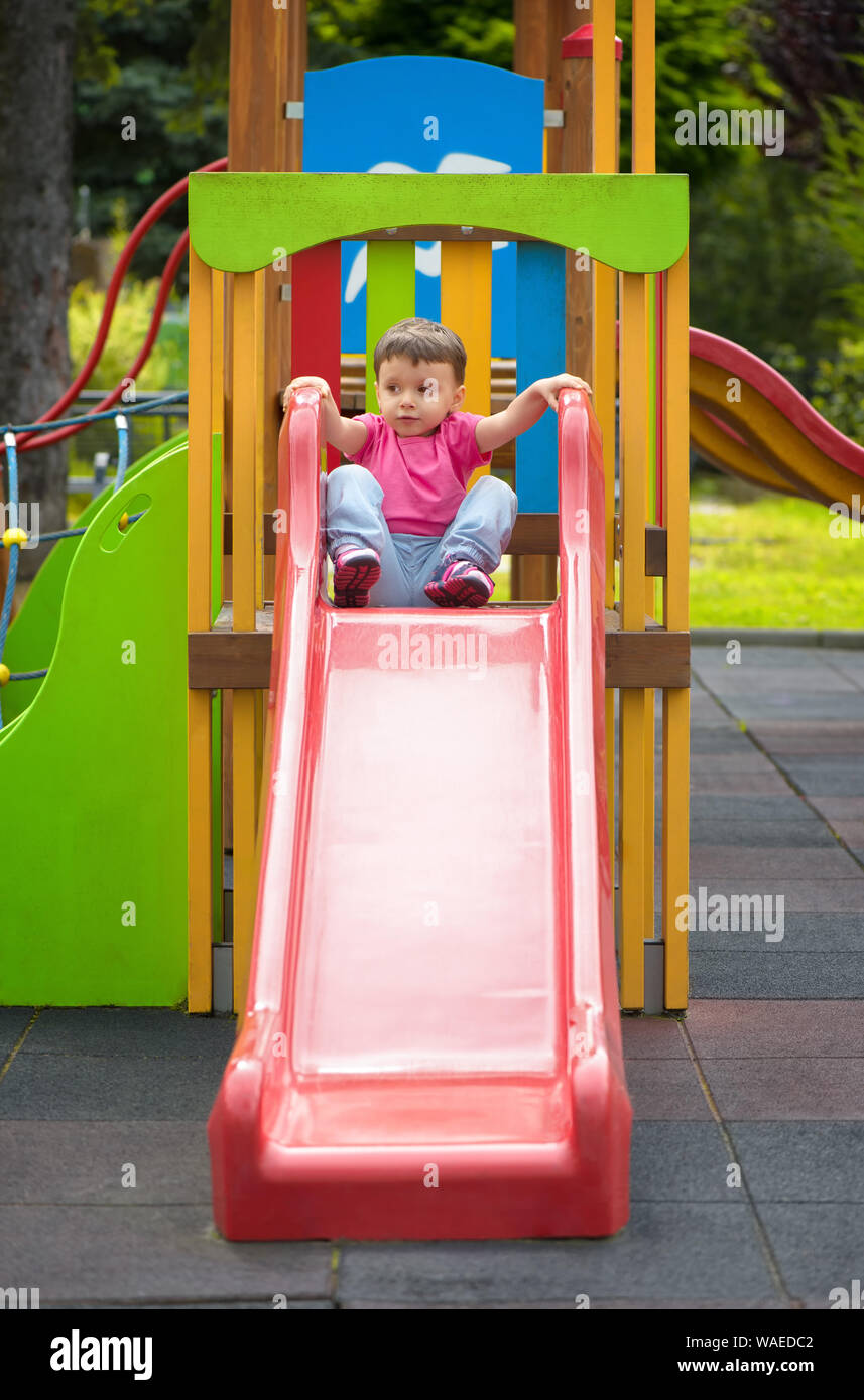 Happy Little Girl Sliding Fotolia
