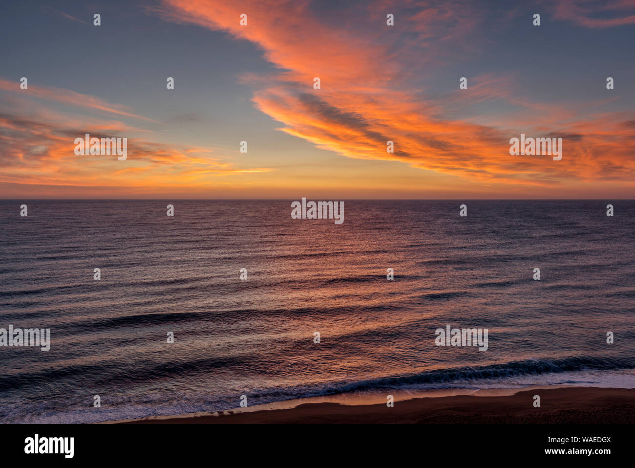 Sunrise over deserted beach hi-res stock photography and images - Alamy