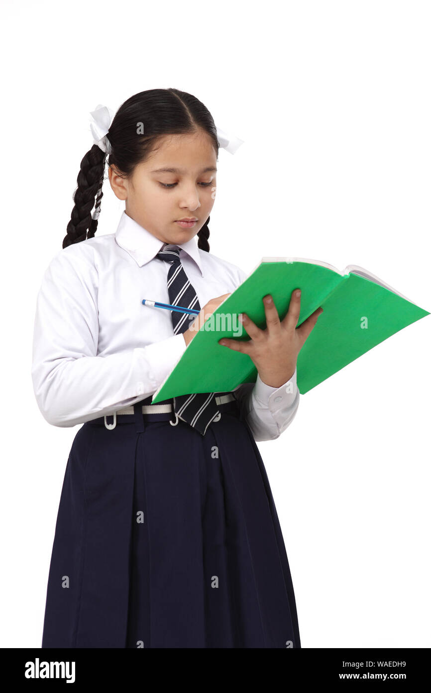 Indian girl writing hi-res stock photography and images - Alamy