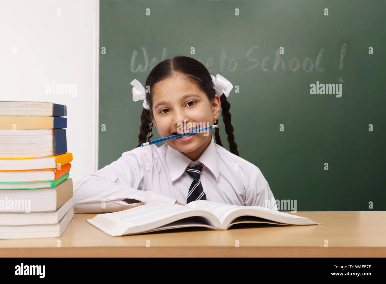 Child pencil in mouth hi-res stock photography and images - Alamy