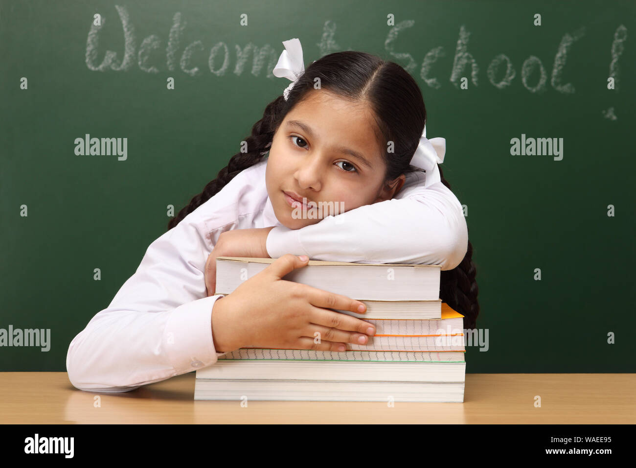 Student leaning head on book hi-res stock photography and images - Alamy