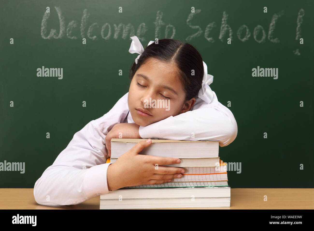 Indian schoolgirl napping in a classroom Stock Photo - Alamy