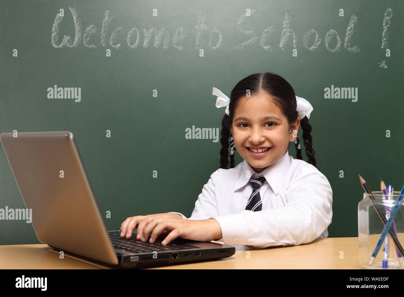 Indian girl using laptop in hi-res stock photography and images - Alamy