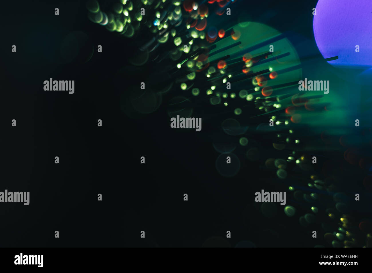 Beautiful multi colored bokeh background on a dark Stock Photo - Alamy