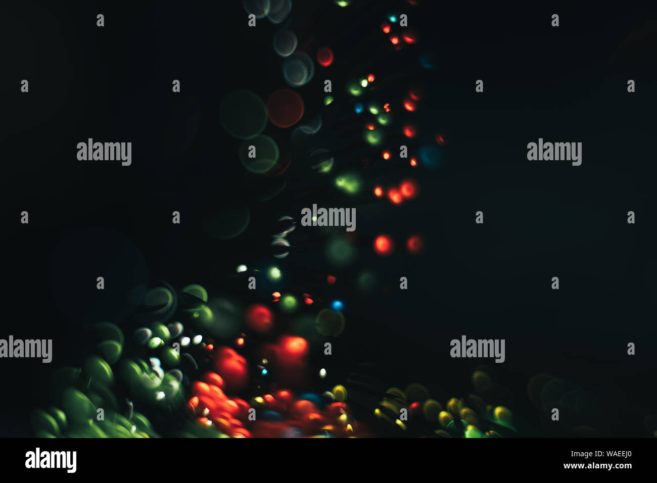 Beautiful multi colored bokeh background on a dark Stock Photo - Alamy
