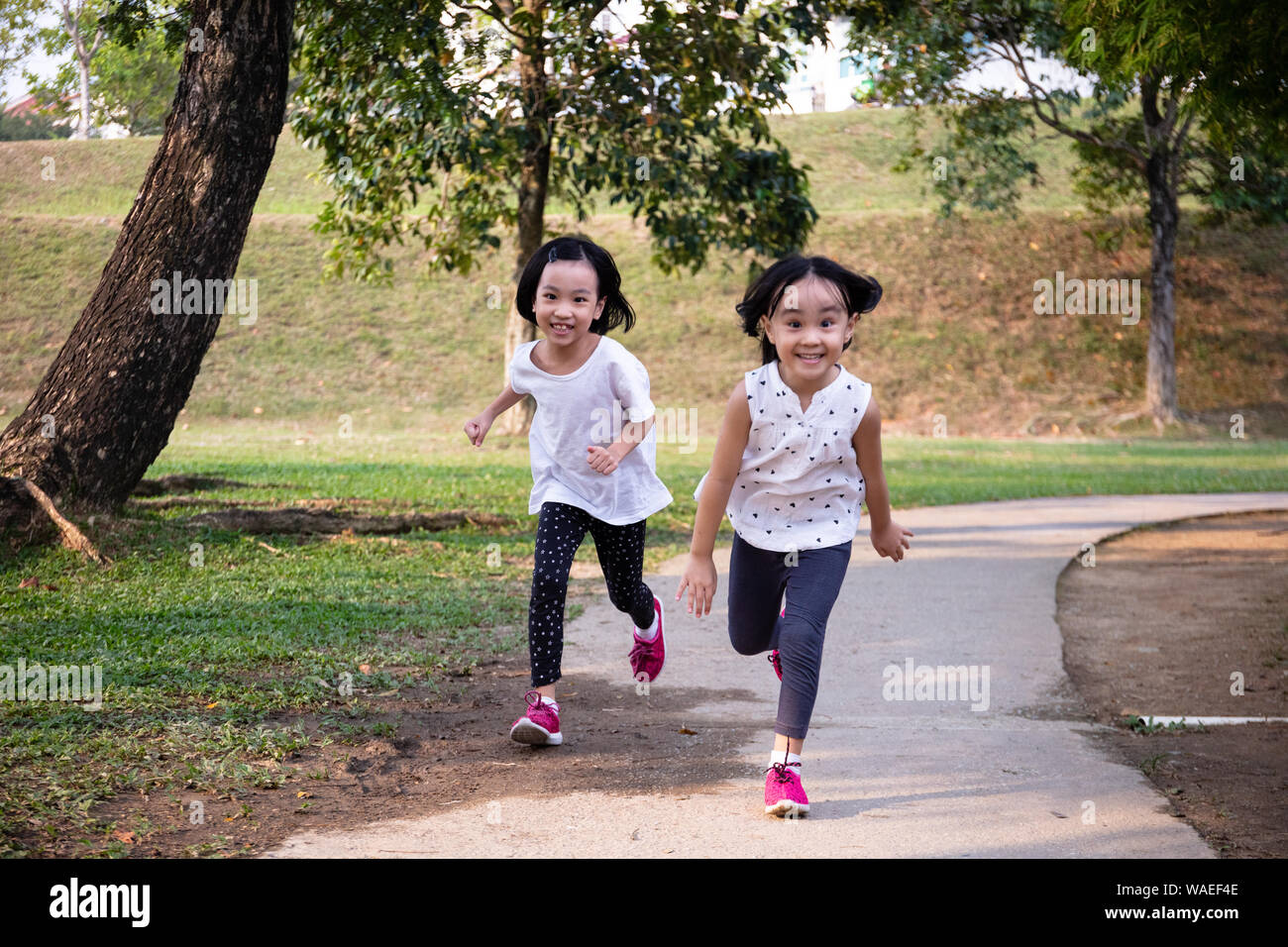 Asian person jogging happily hi-res stock photography and images - Alamy