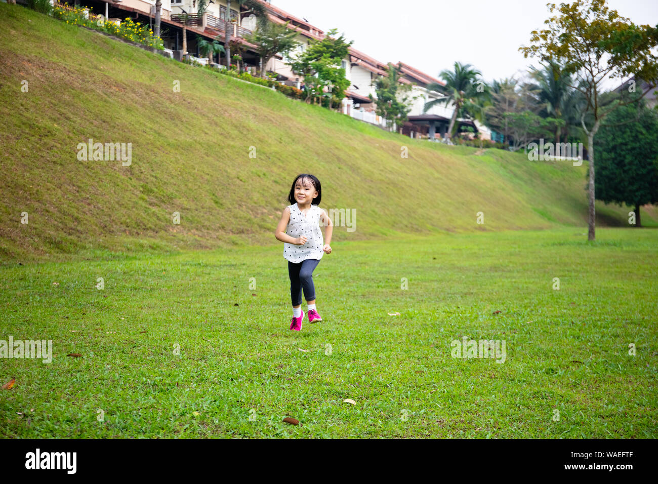 Asian Little Chinese Girl running happily at the outdoor park Stock ...