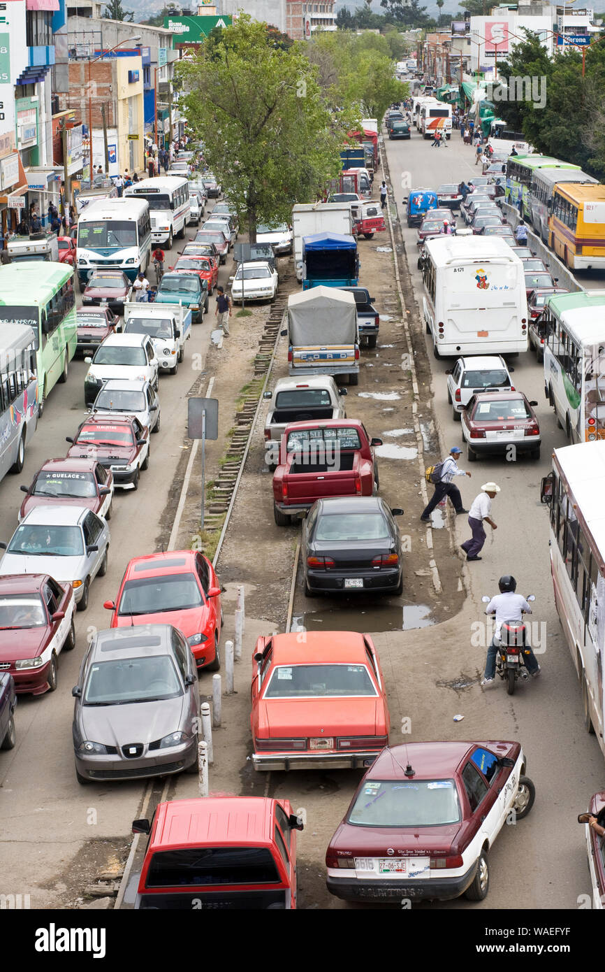Traffic jam with cars and buses on busy, crowded street, Oaxaca City ...