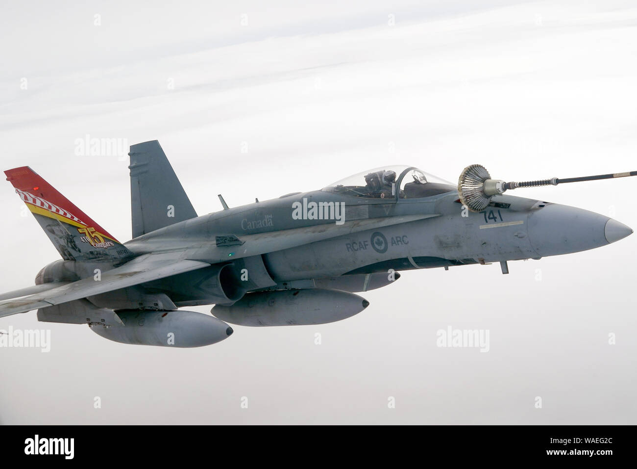 A Royal Canadian Air Force CF-18 Hornet receives fuel from a CC-150 ...
