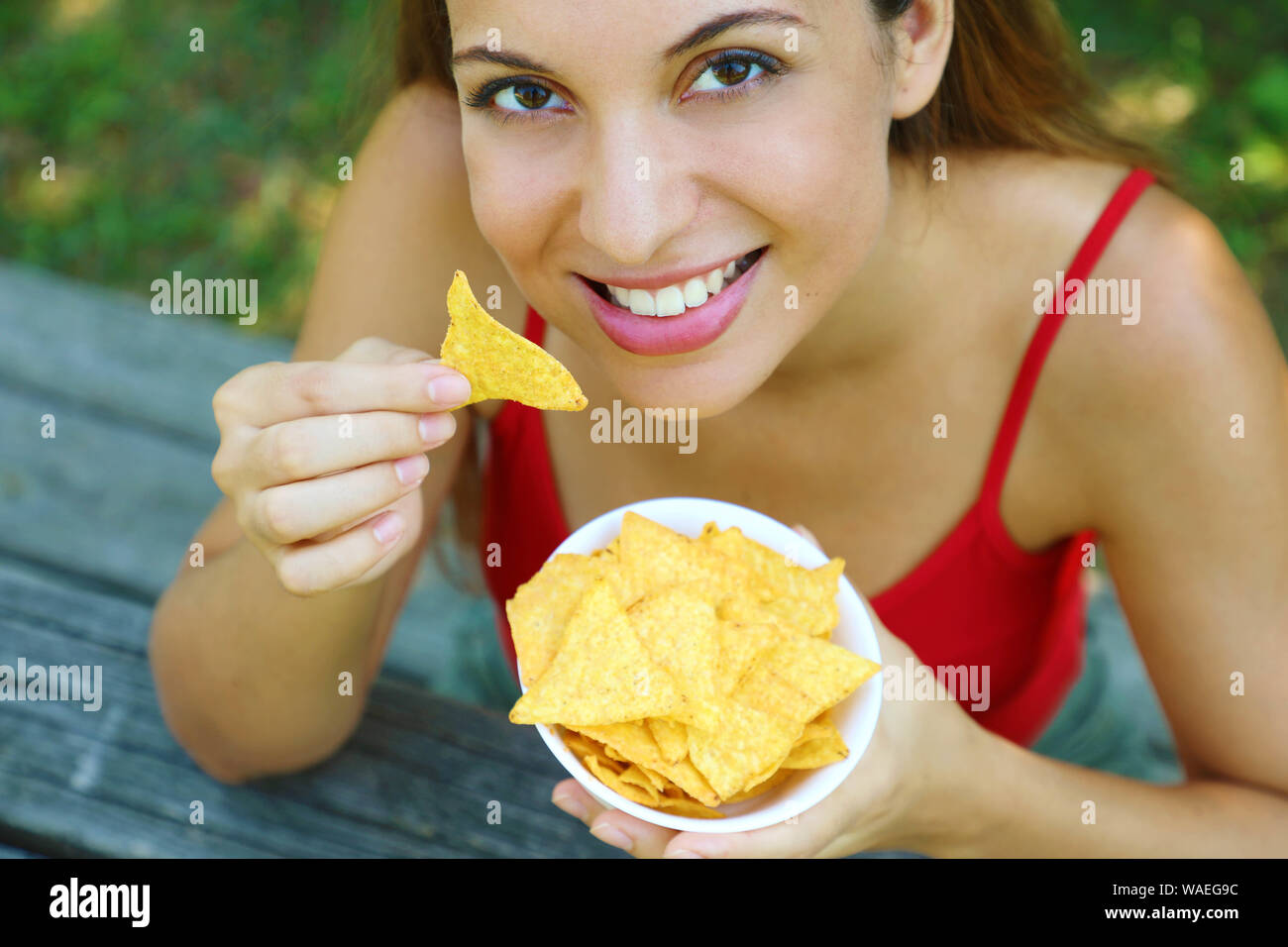 Chips outdoor eating woman hi-res stock photography and images - Alamy