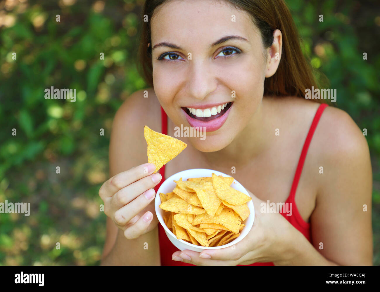 Cheerful women eating chips hi-res stock photography and images - Alamy